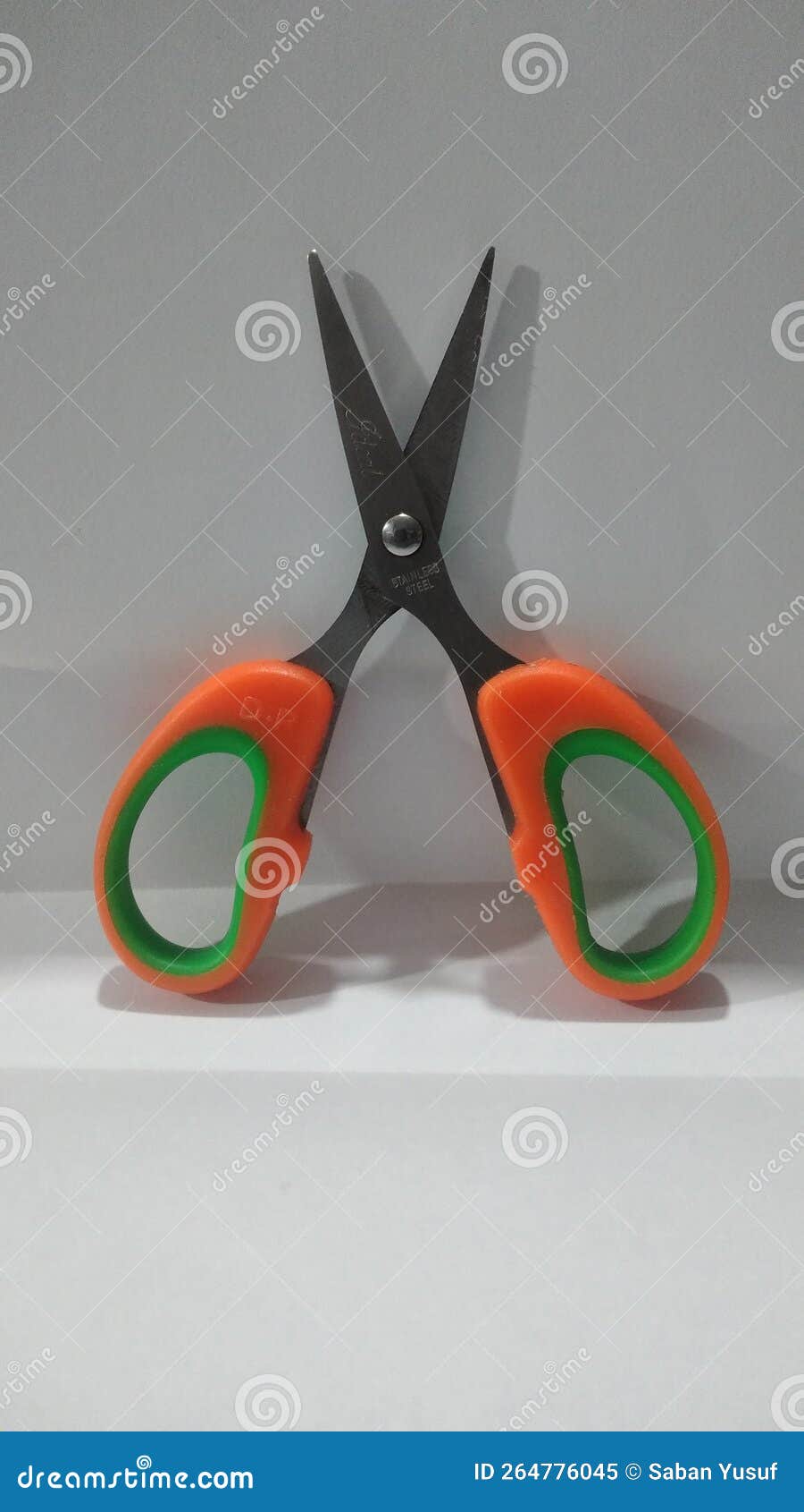Small Scissors with Orange Handles on a White Background Editorial ...