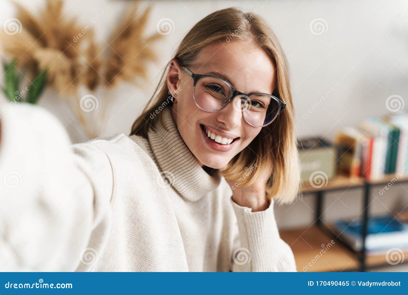 Photo Of Smiling Attractive Woman In Eyeglasses Taking Selfie Photo