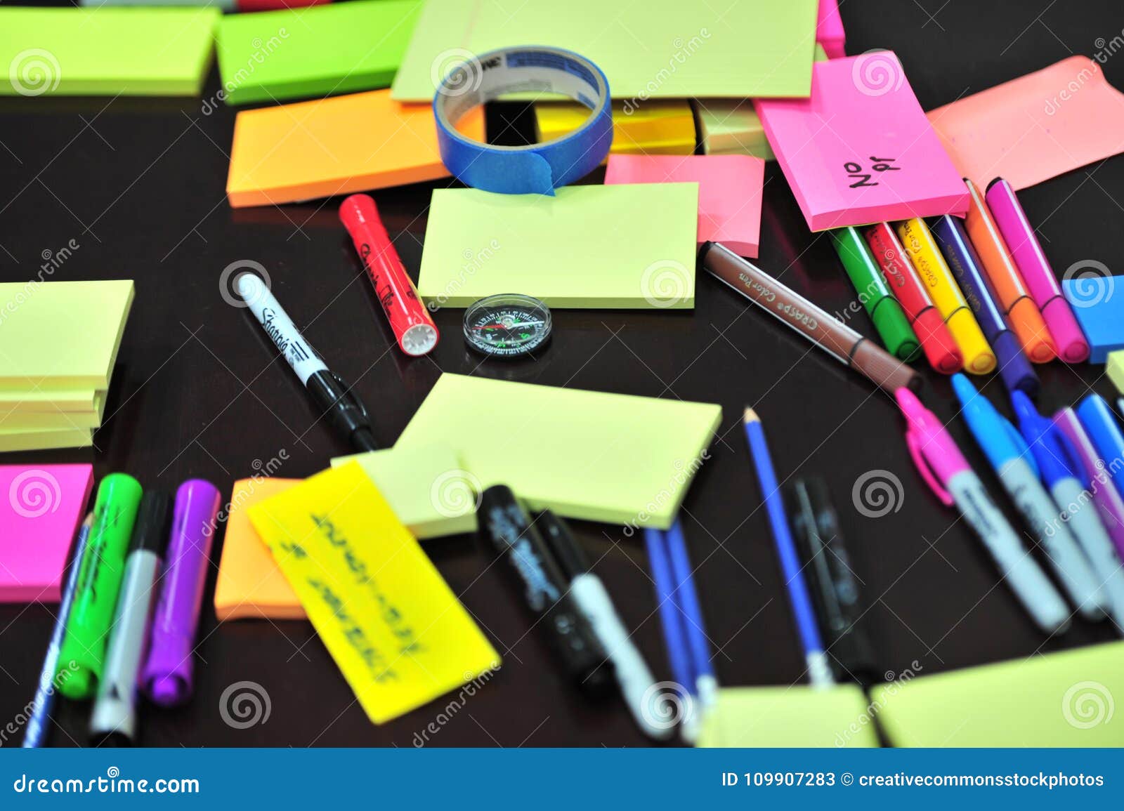 Photo Of Sticky Notes And Colored Pens Scrambled On Table Picture ...