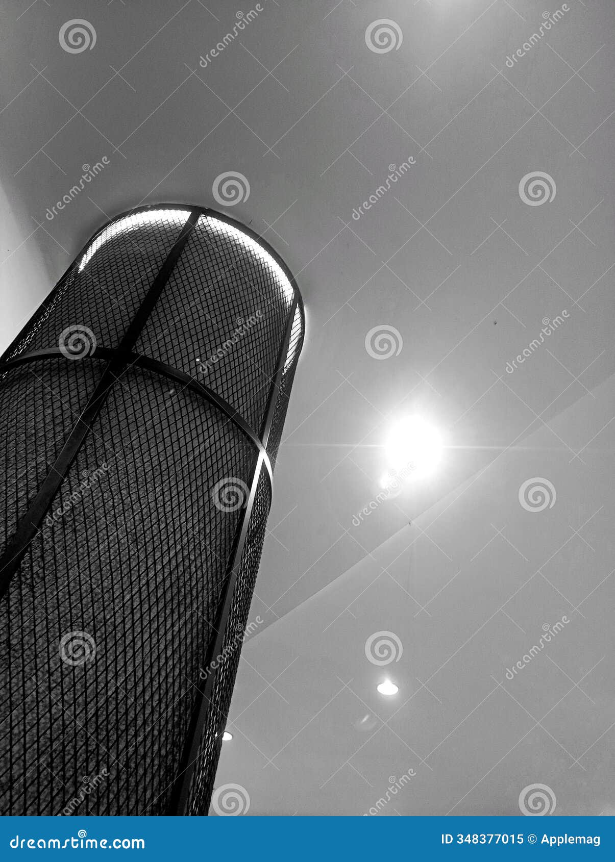 A Photo of a Structural Pole with Wire Mesh Surrounding the Pole in ...