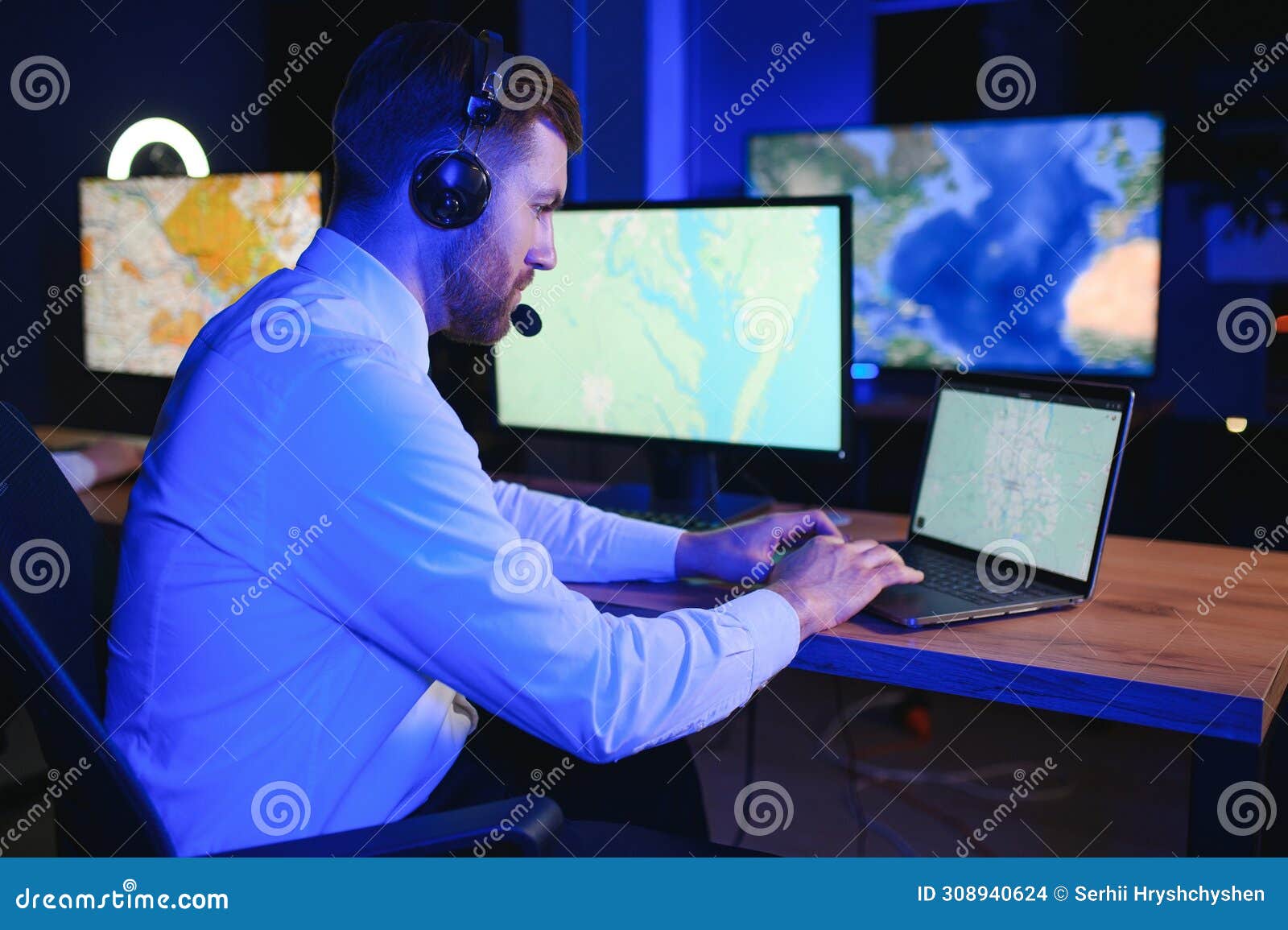 Photo of a Successful Dispatcher Working on a Computer in the Office ...
