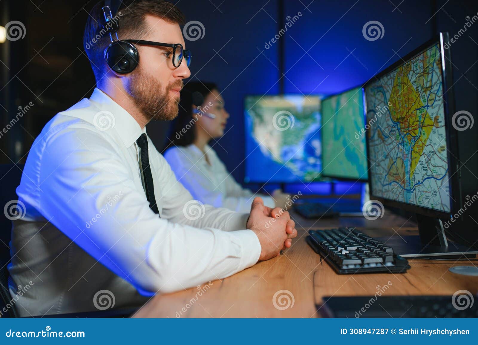 Photo of a Successful Dispatcher Working on a Computer in the Office ...