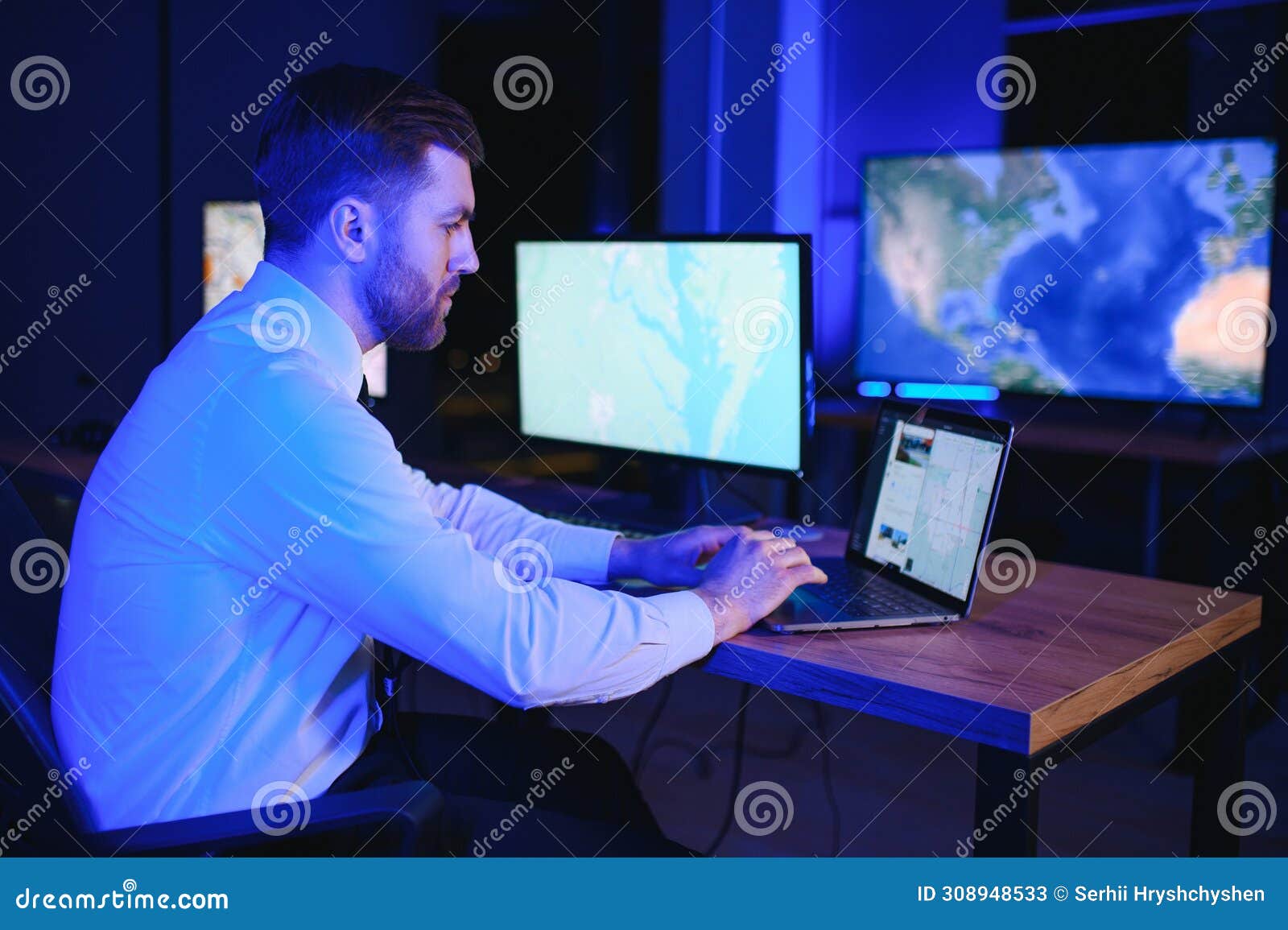Photo of a Successful Dispatcher Working on a Computer in the Office ...