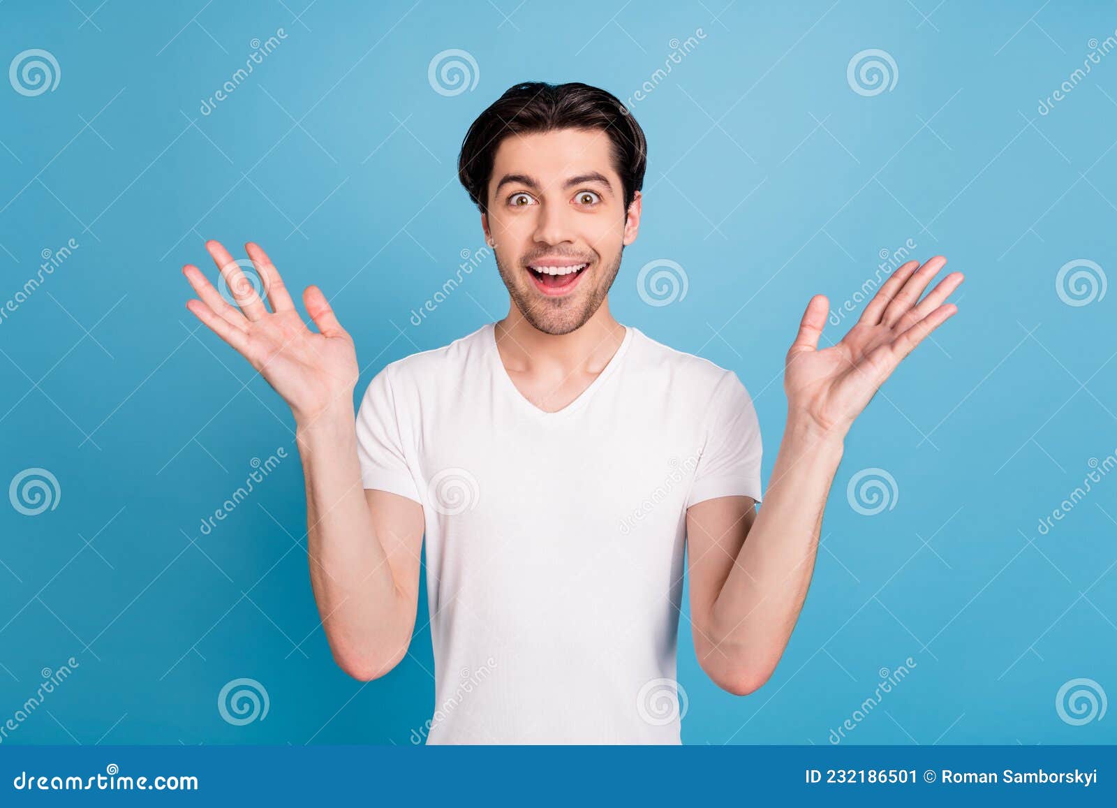 Photo Of Surprised Amazed Funky Guy Raise Hands Omg Reaction Wear White