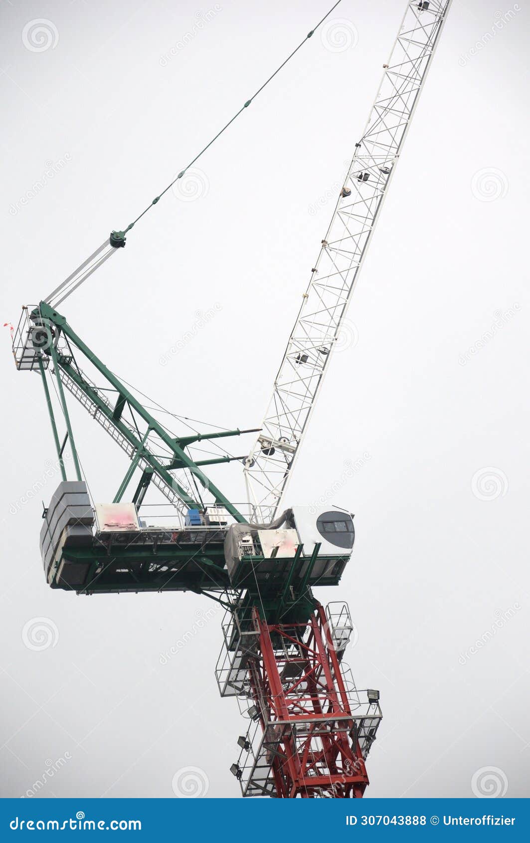 A Construction Fixed Tower Crane Hoist at a Construction Side Against a ...