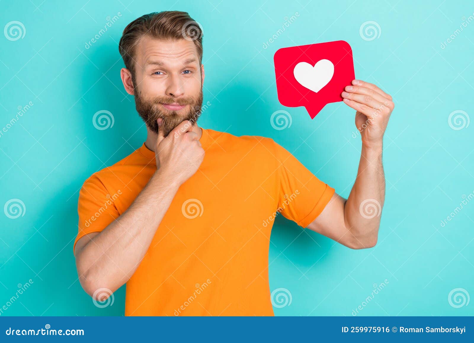 Photo Of Thinking Brown Hairdo Guy Hold Like Wear Orange T Shirt
