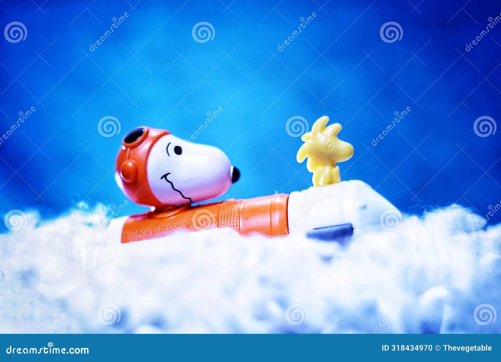 Photo of Toy Snoopy Flying through the Clouds Stock Photo - Image of ...