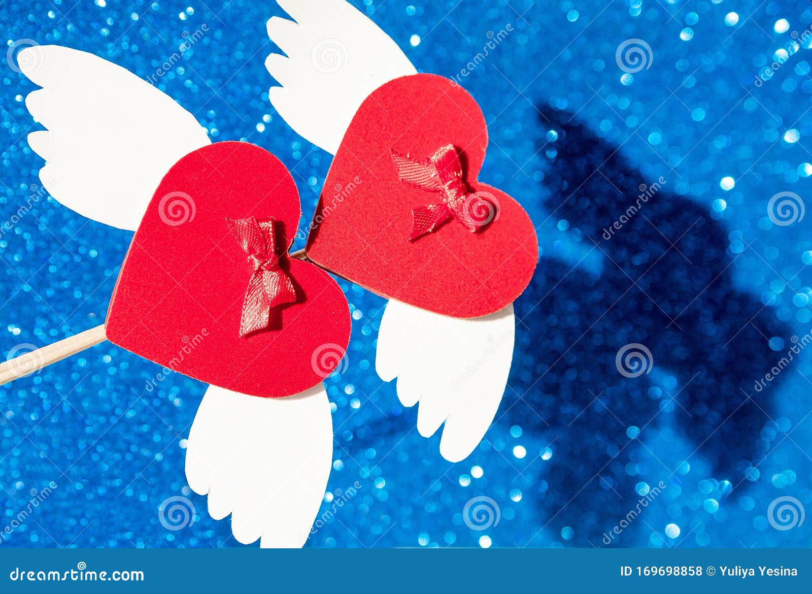 Two Hearts with Wings on a Blue Background Stock Photo - Image of ...