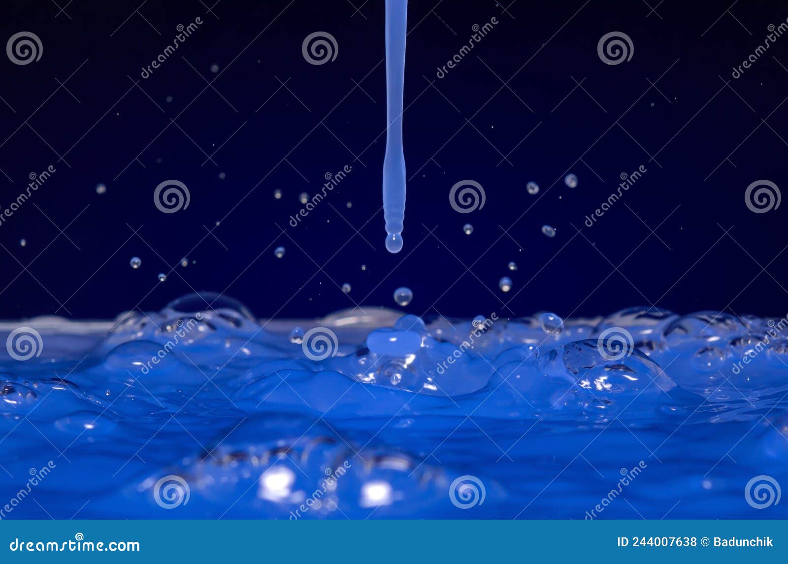 Photo of Water Drops Falling on Water and Splash on Black Background ...