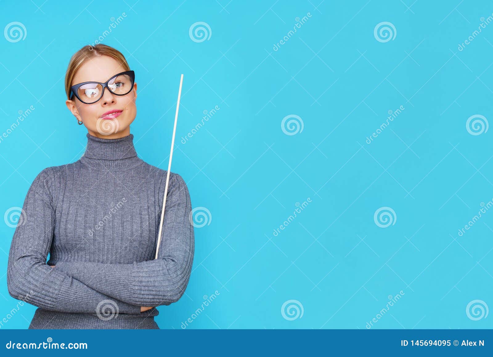 Photo of Woman Teacher with Pointer on Empty Blue Background. Stock ...