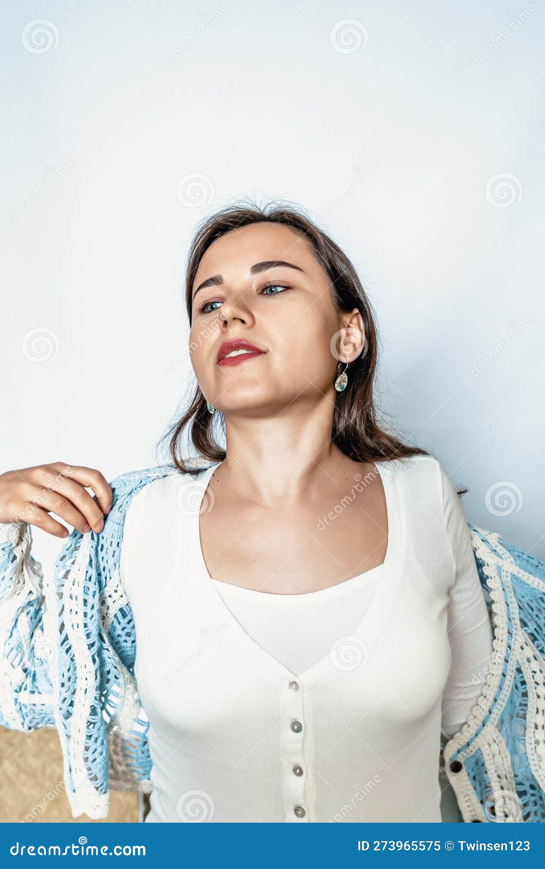 Photo Of A Woman Undressing Cute Young Woman Takes Off Blue Sweater