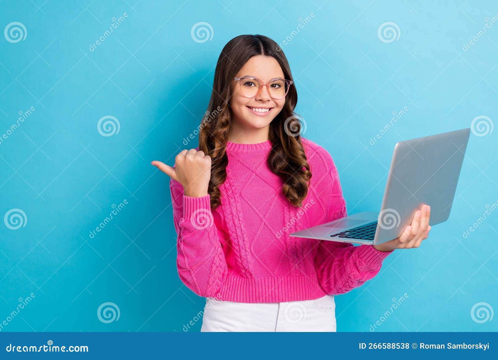 Photo of Young it Coder School Girl Wear Pink Knitted Pullover Hold ...