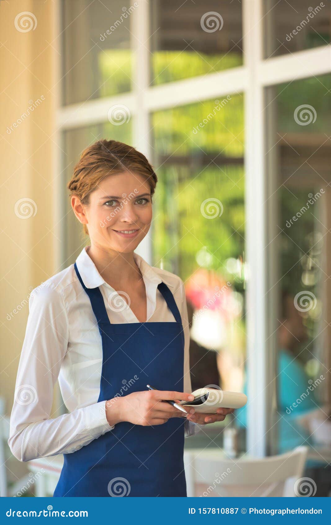 Young Confident Waitress Writing on Notepad at Restaurant Stock Image ...