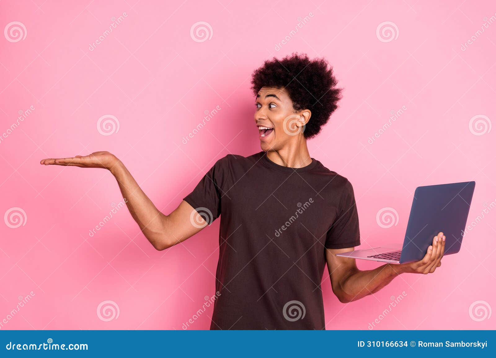 Photo of Young Excited Amazed Man Software Developer Demonstrate Empty ...