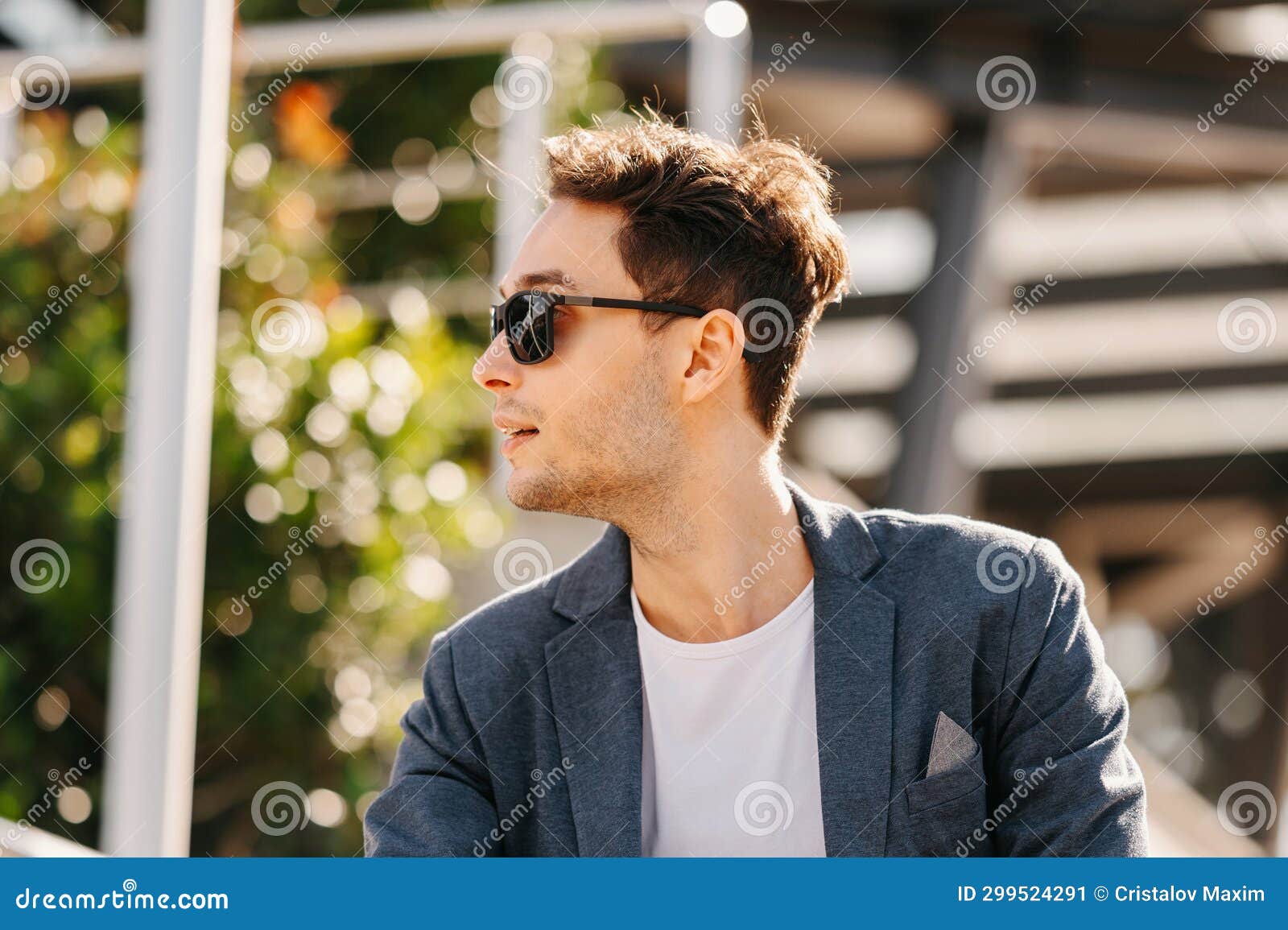 Photo of Young Man in City Looking Away or Searching for Something ...