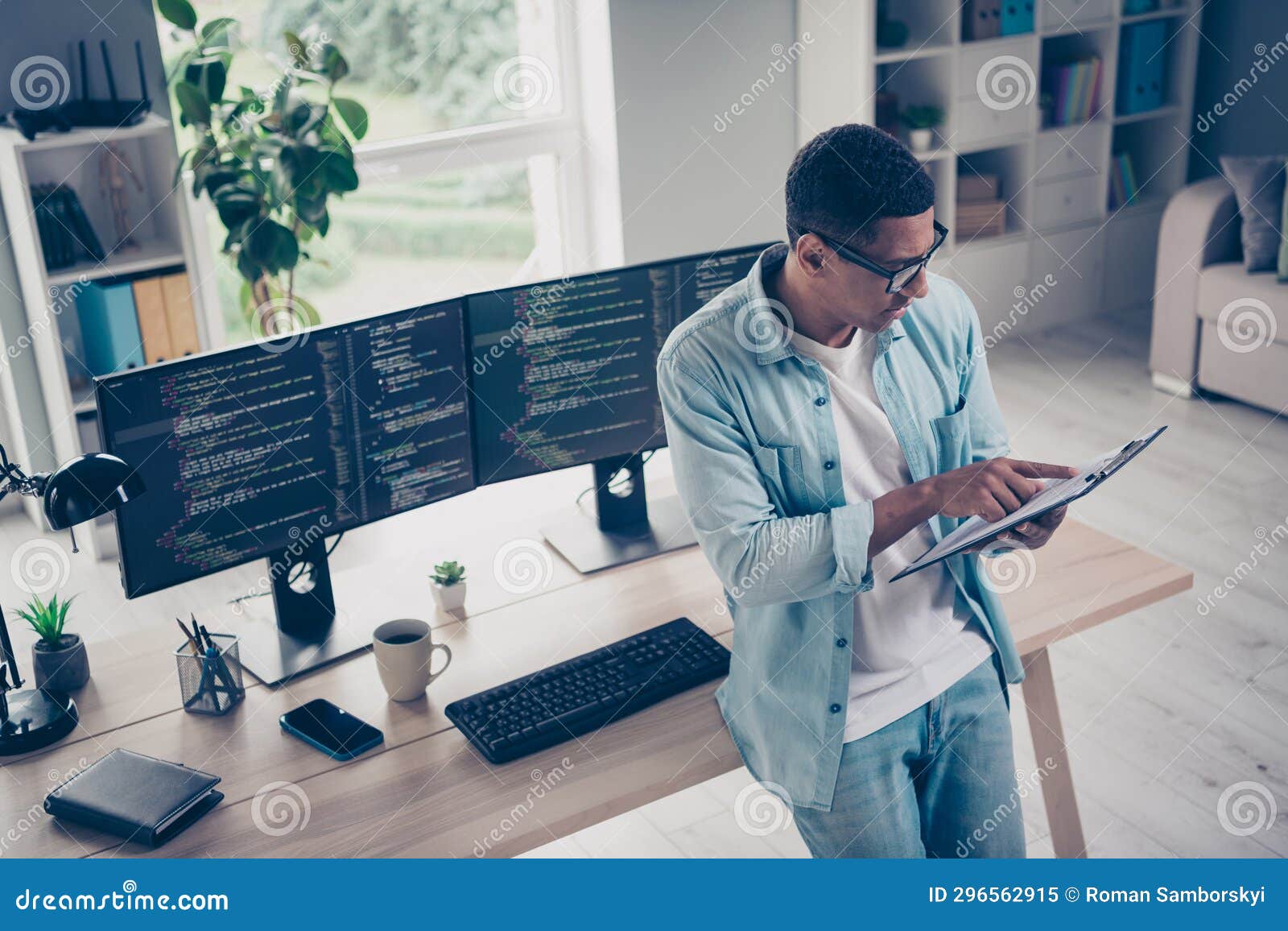 Photo of Young Ponder Man it Specialist Programmer Reading Paper ...