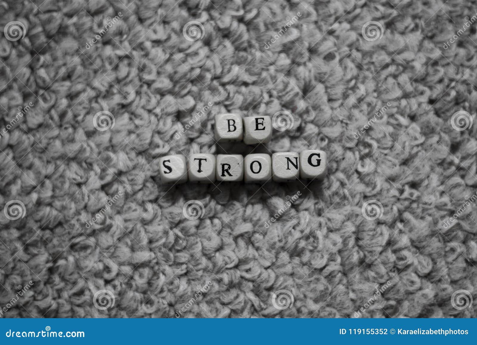 Black and White Be Strong Letters on Fabric Background Stock Photo ...
