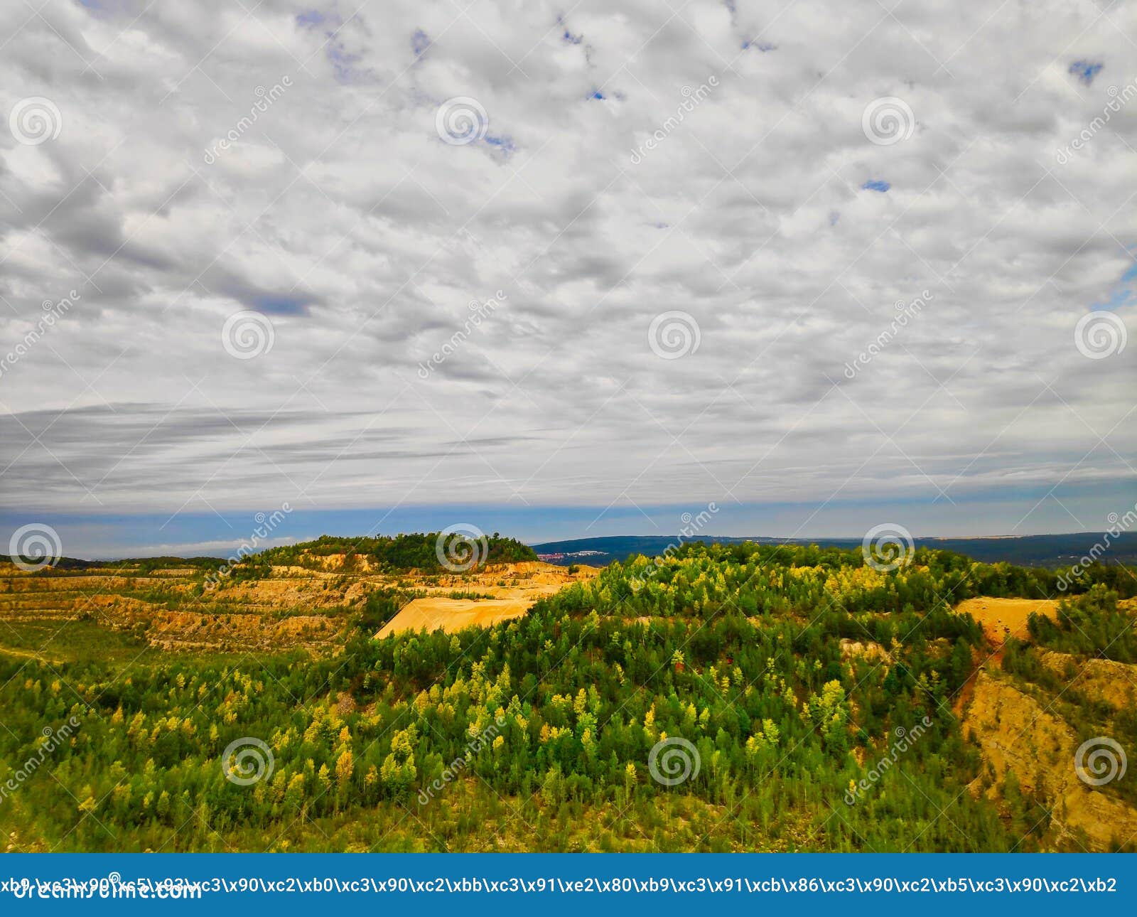 Photograph Landscape of a Lime Quarry with Many Trees and a Cloudy Sky ...