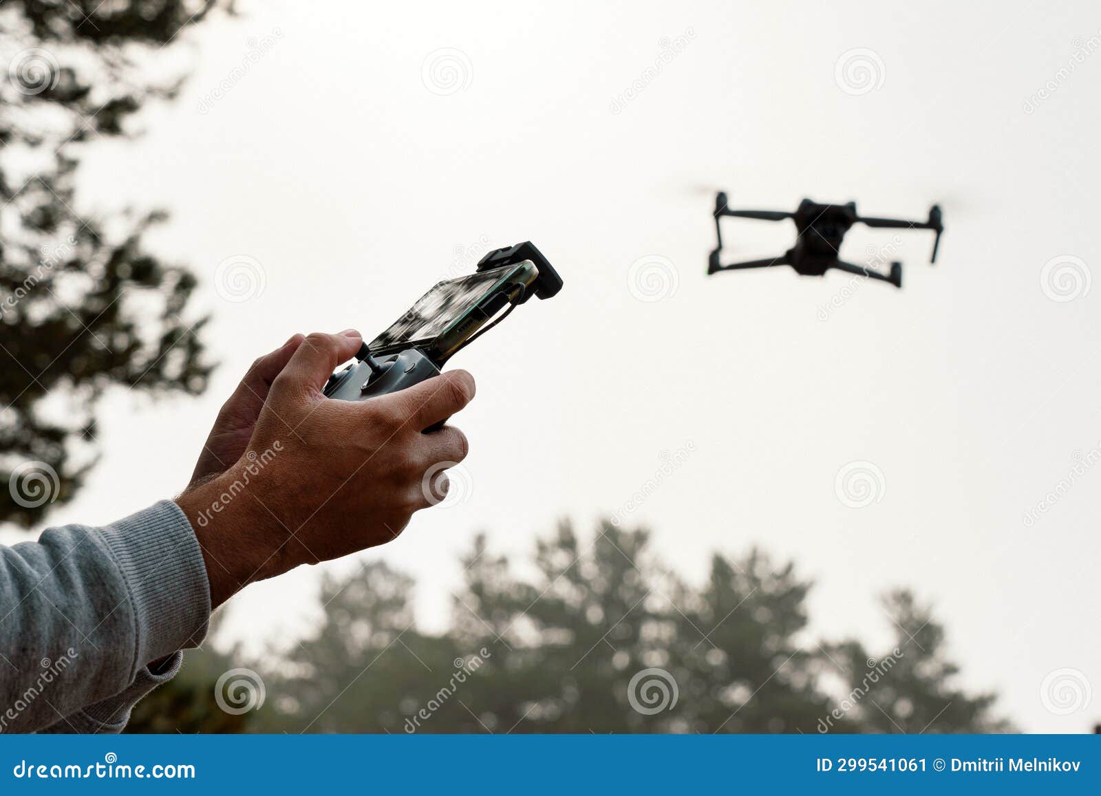 Photograph of Man Hands Holding the Remote Control of a Drone Drone ...