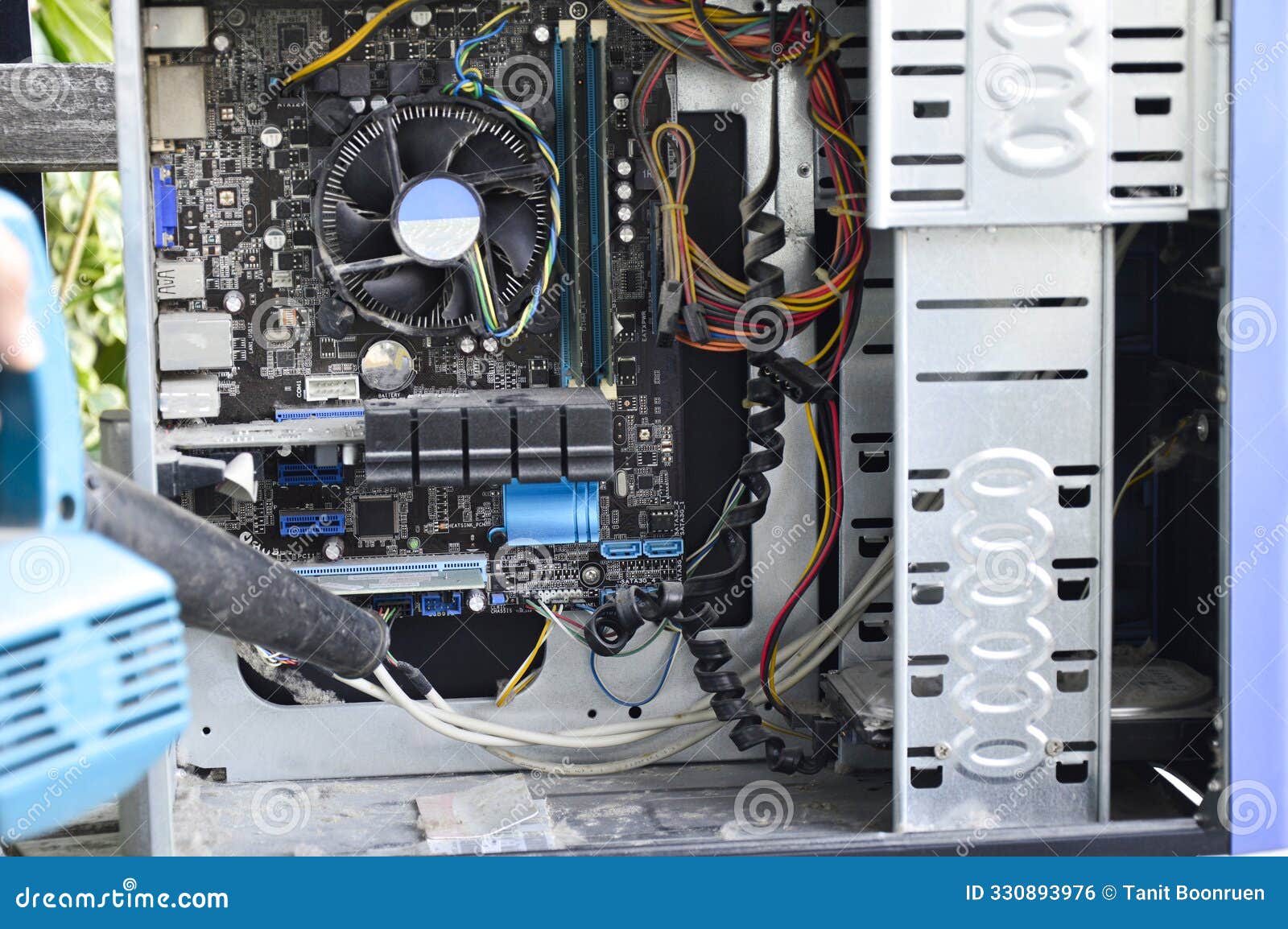 Photograph of a Technician Blowing Dust from a Computer Stock Photo ...