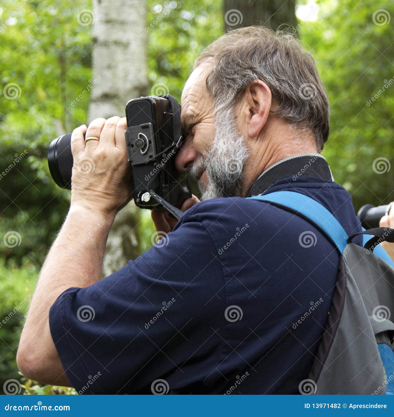 Photographer stock photo. Image of focus, hair, canon - 13971482