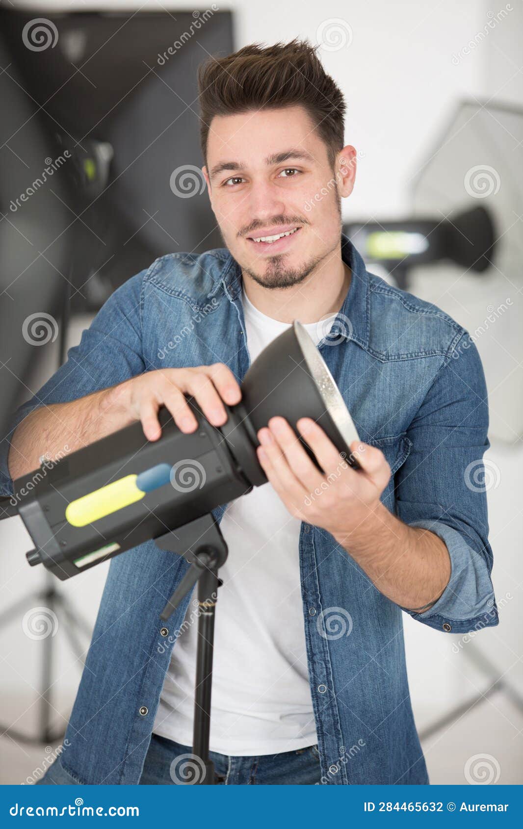 Photographer Angling Spotlight in Preparation for Photo Shoot Stock ...