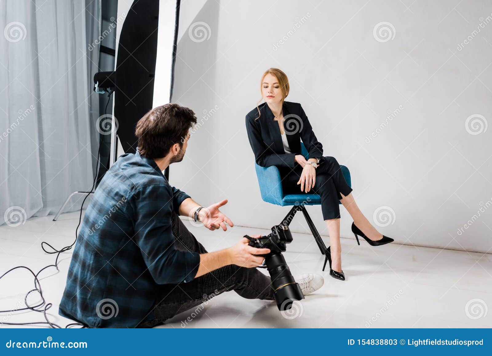 Photographer with Camera and Young Model Talking Stock Image - Image of ...
