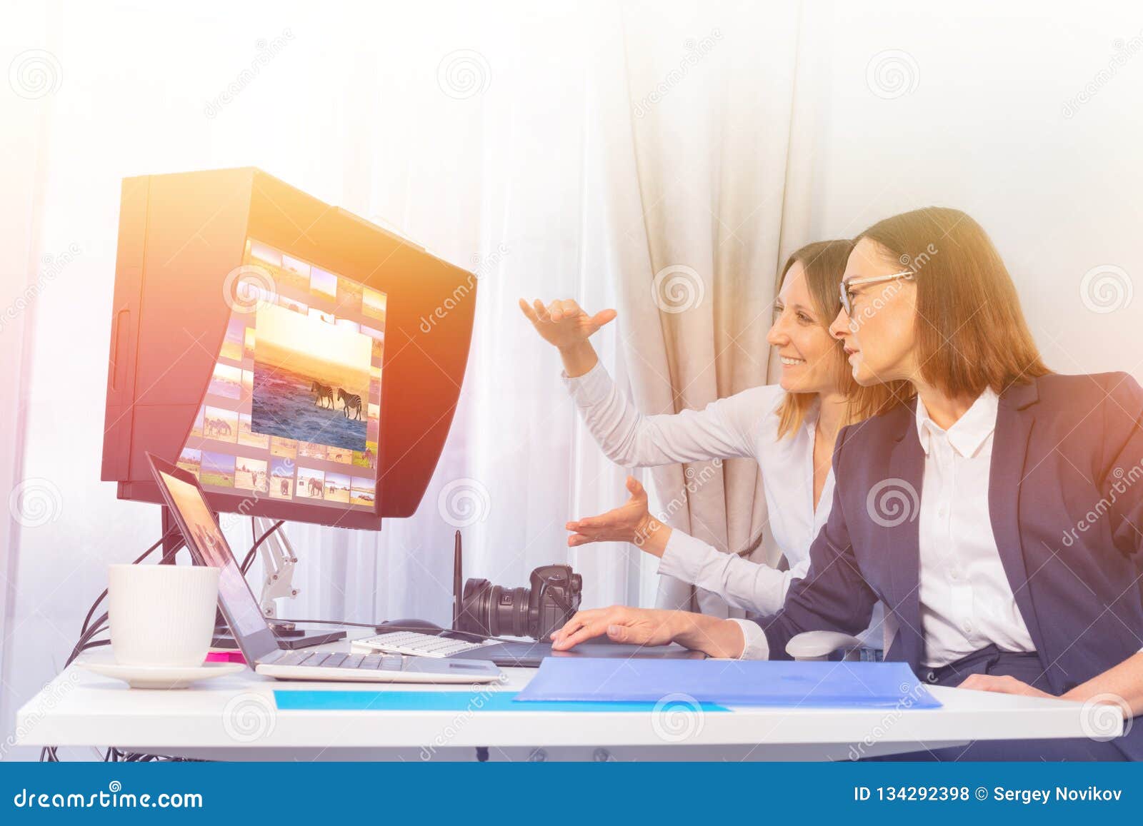 Photographer and Client Editing Photos in Office Stock Photo - Image of ...