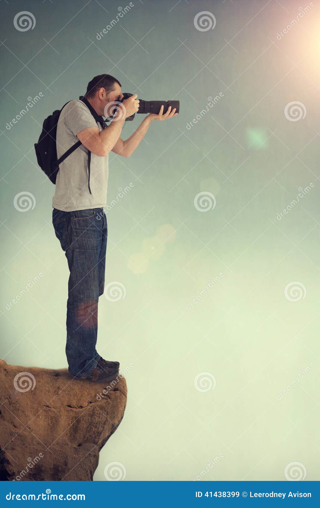 Photographer on Cliff Ledge Stock Image - Image of equipment, camera ...
