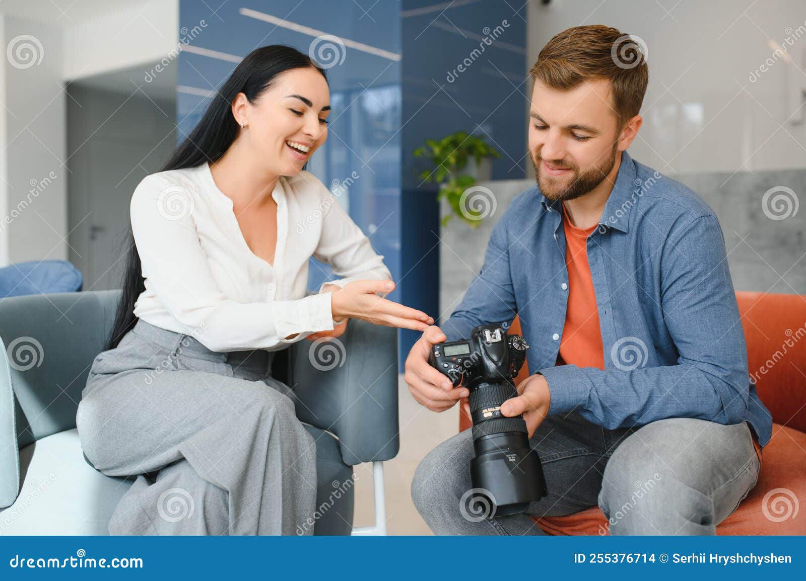 Photographer Communicates with the Client in the Office. Stock Photo ...