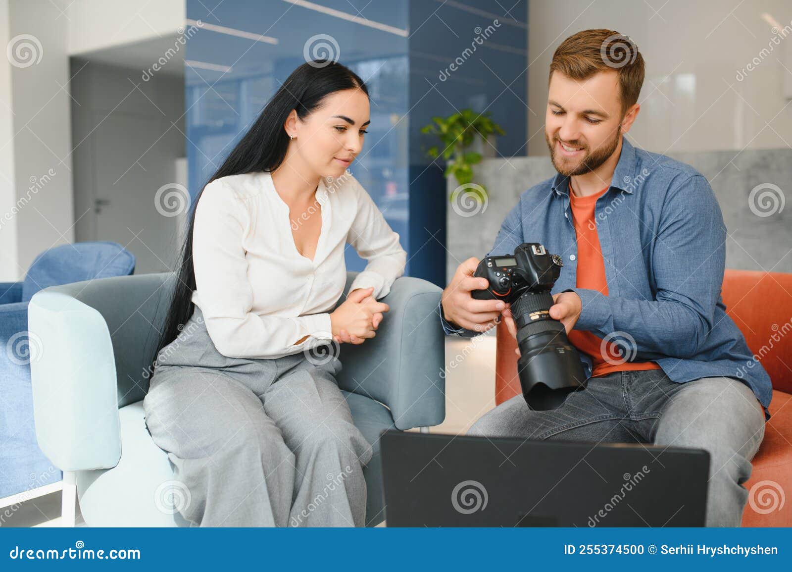 Photographer Communicates with the Client in the Office. Stock Photo ...