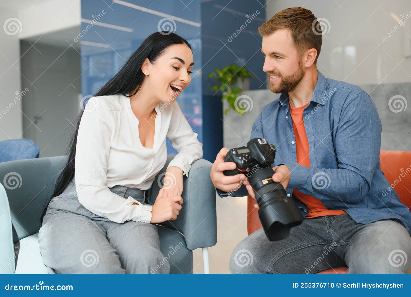 Photographer Communicates with the Client in the Office. Stock Photo ...