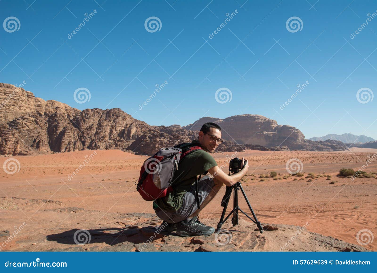 Photographer in the desert stock image. Image of landscape - 57629639