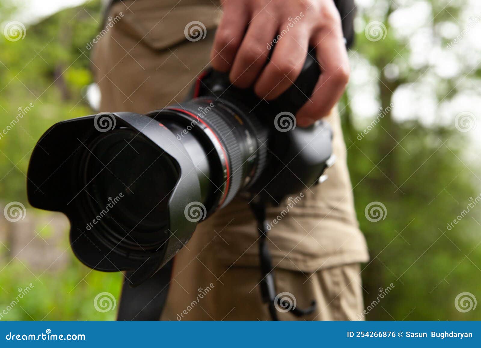 Photographer Holding a Camera in His Hand Stock Photo - Image of nature ...
