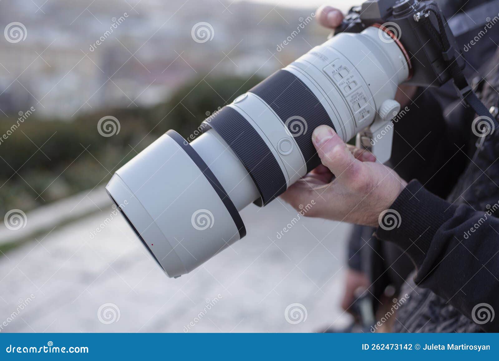 Photographer Holding a Camera Stock Photo - Image of outdoor, holding ...