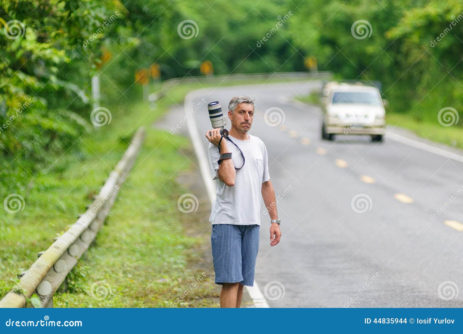 Photographer in the jungle stock photo. Image of lens - 44835944