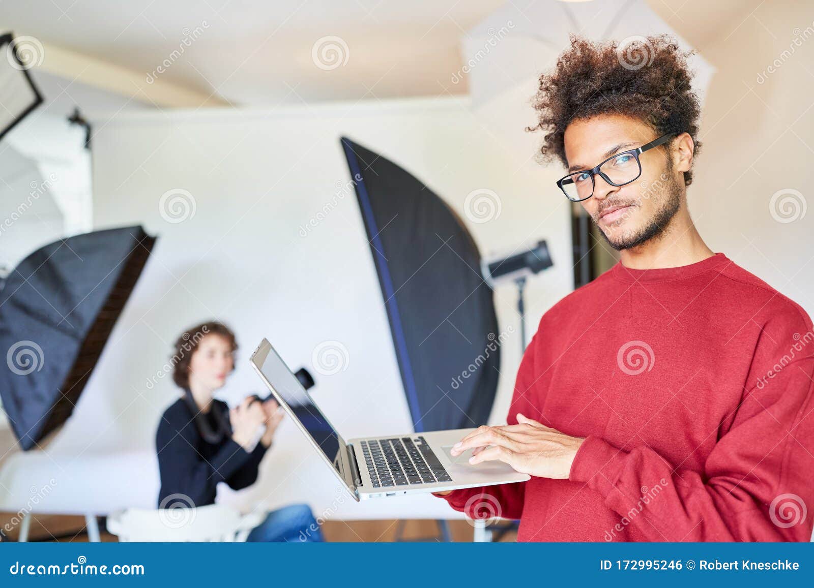 Photographer with Laptop Computer during Data Backup Stock Photo ...