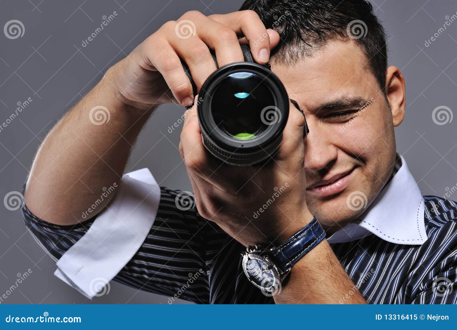 Photographer making a shot stock image. Image of equipment - 13316415