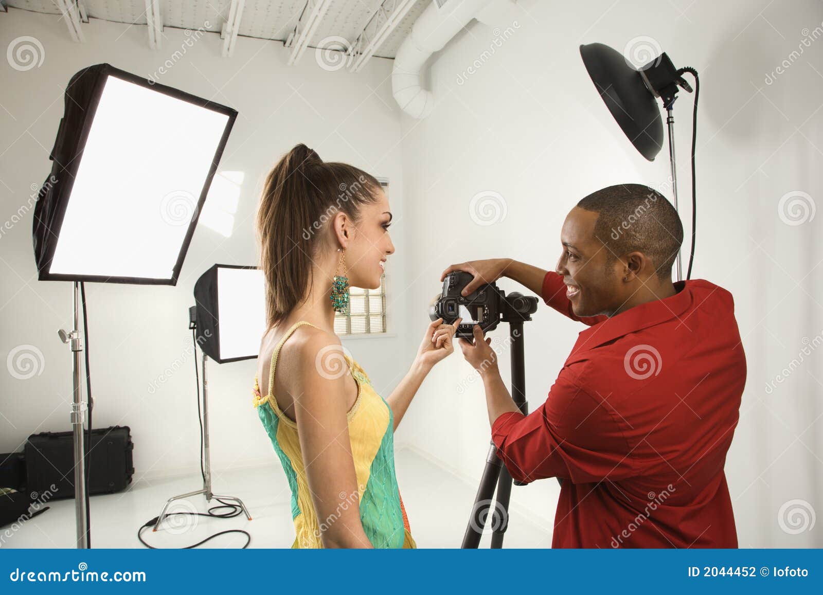 Photographer with a model. stock photo. Image of color - 2044452