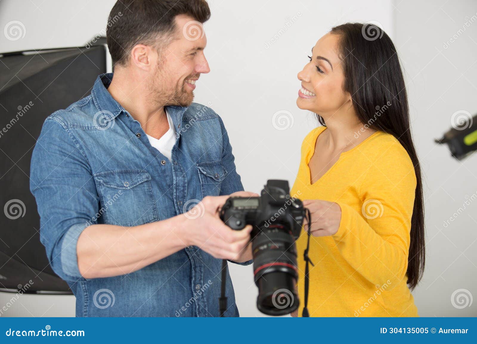 Photographer and Model Reviewing Photoson Camera Stock Image - Image of ...