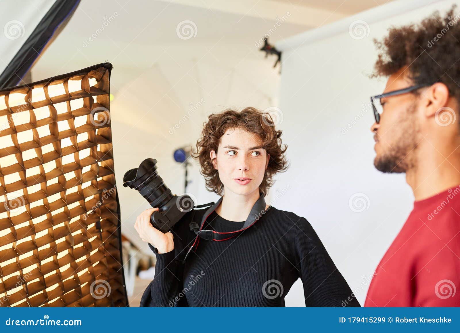 Photographer and Photo Assistant are Planning a Photo Shoot Stock Image ...