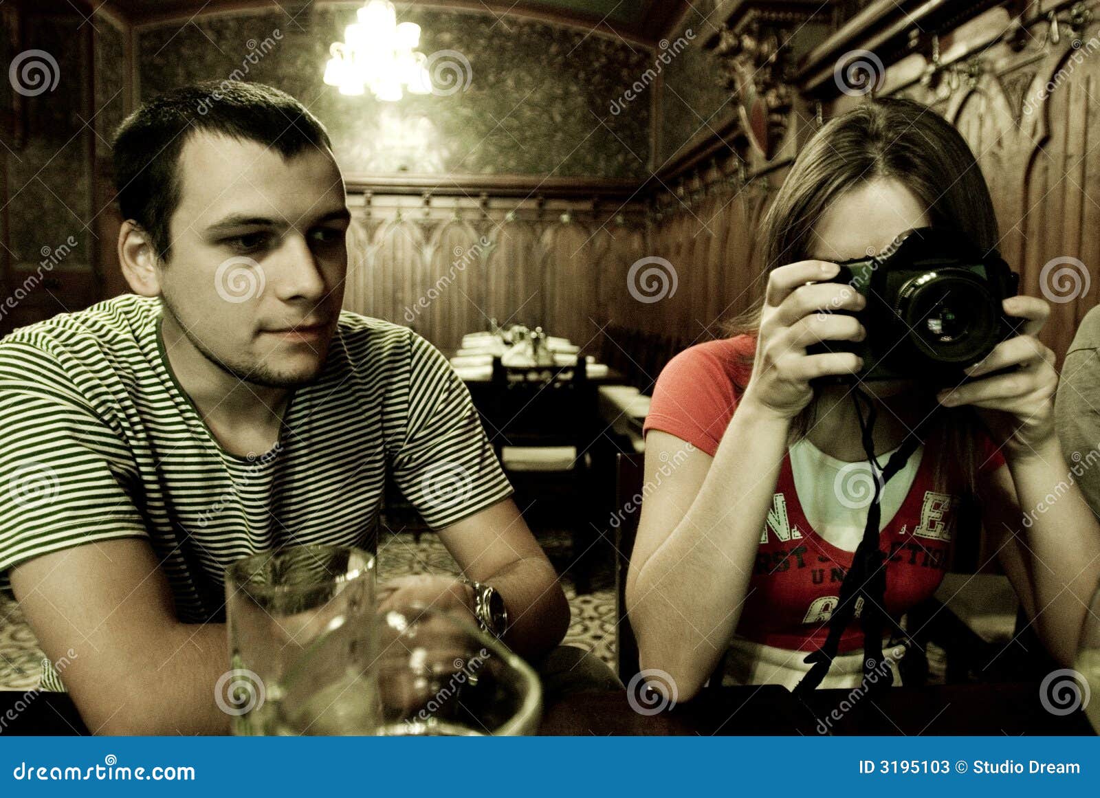 Photographer in restaurant stock image. Image of catch - 3195103