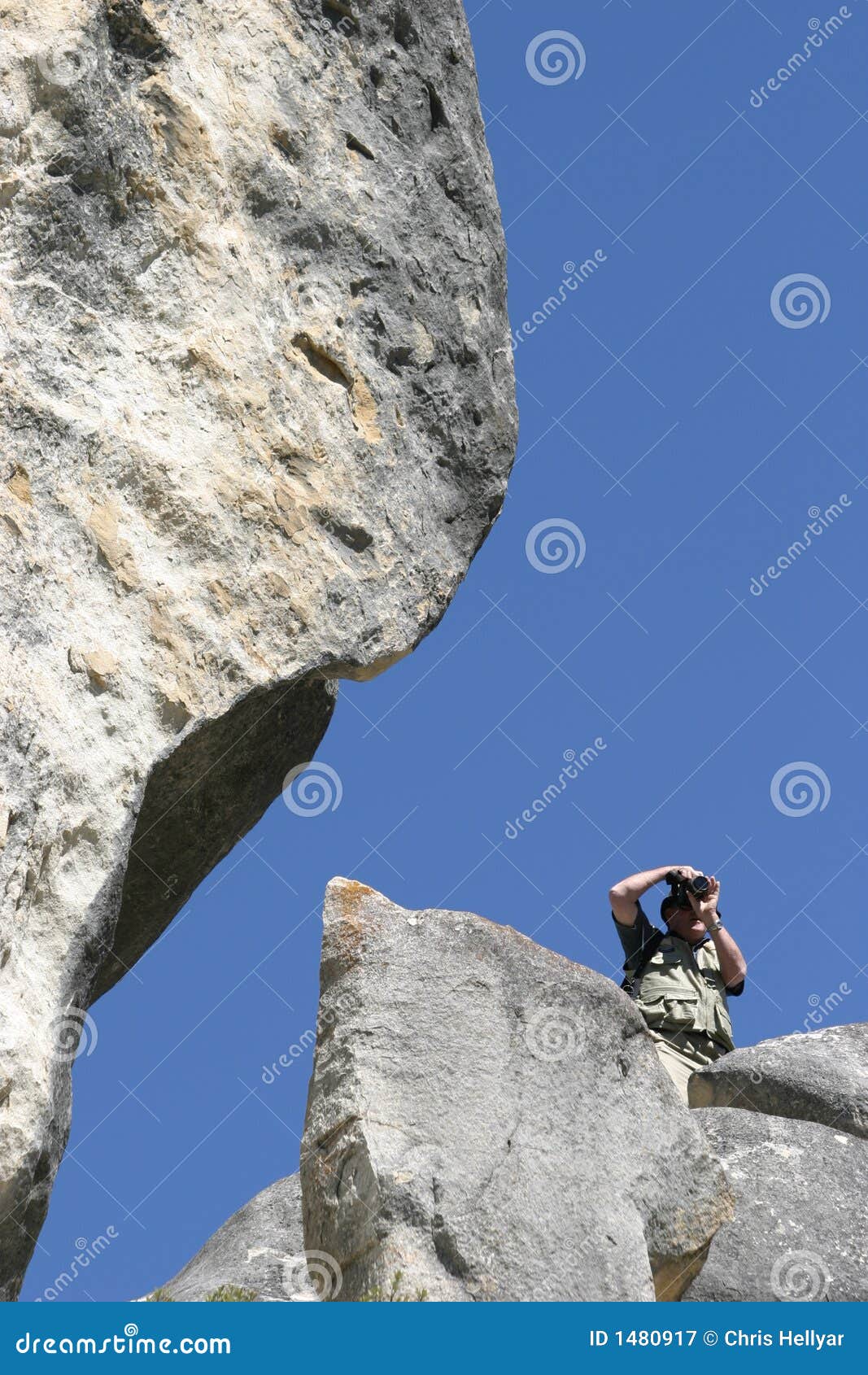 Photographer on the rocks stock image. Image of alps, landscape - 1480917