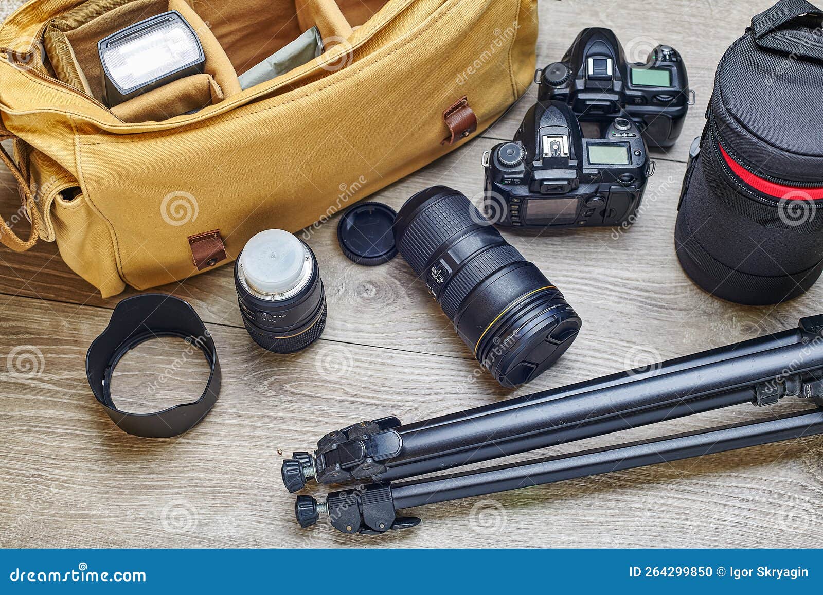 Photographer`s Bag with Cameras and Lenses is Ready for Packing Stock ...