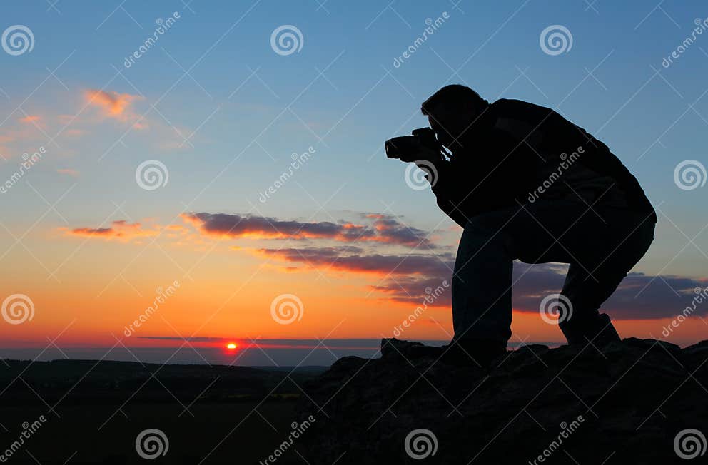 Photographer s silhouette. stock photo. Image of dusk - 19432156