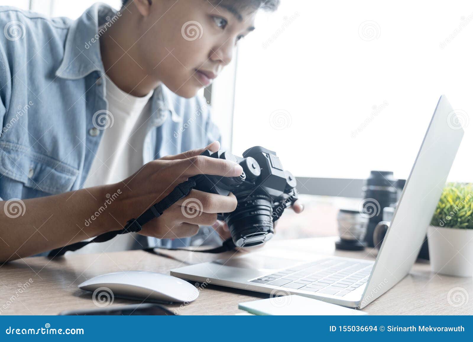 Photographer Select Image from Digital Camera To Edit Stock Photo ...