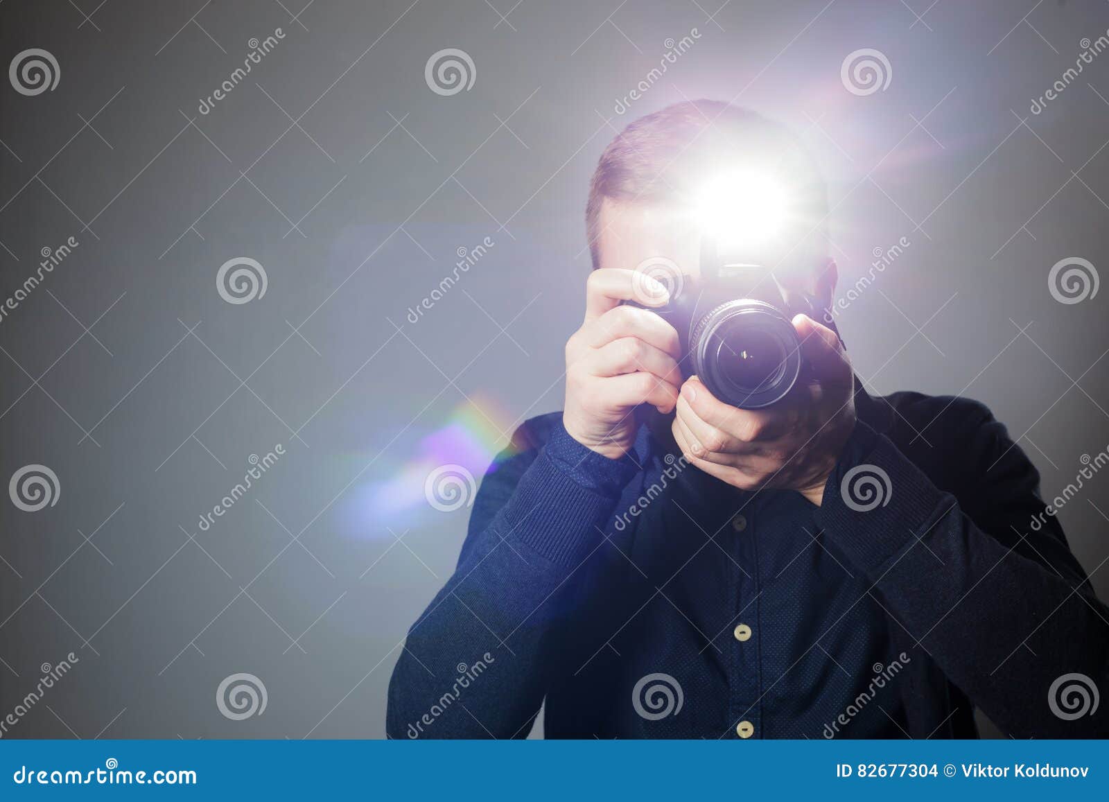 Photographer Takes a Picture in the Studio Using a Flash Stock Photo ...