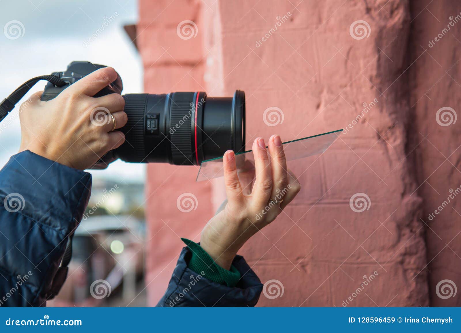 A Photographer Using Additional Devices To Get Effects on a Photo Stock ...