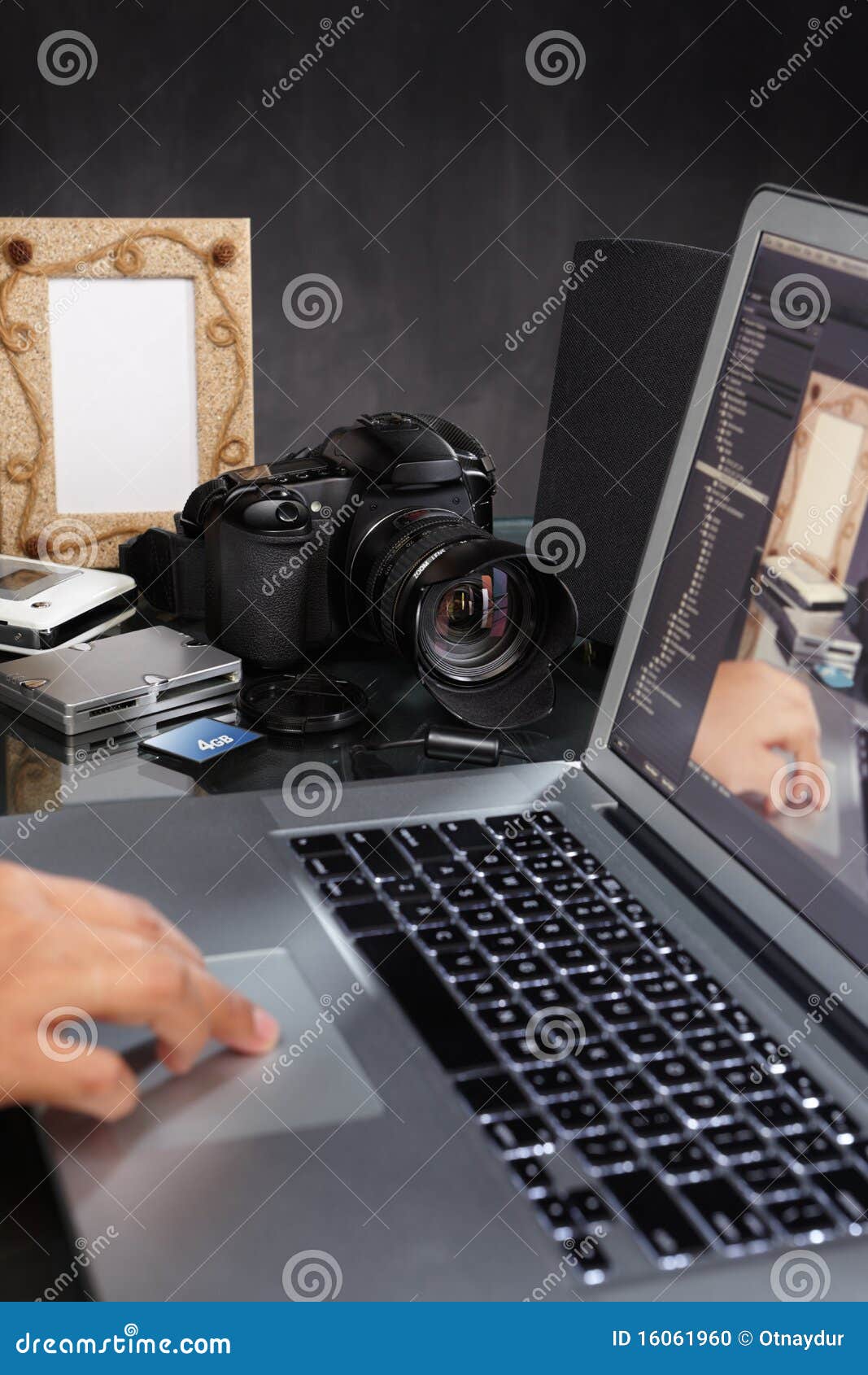 Photographer using laptop stock photo. Image of camera - 16061960