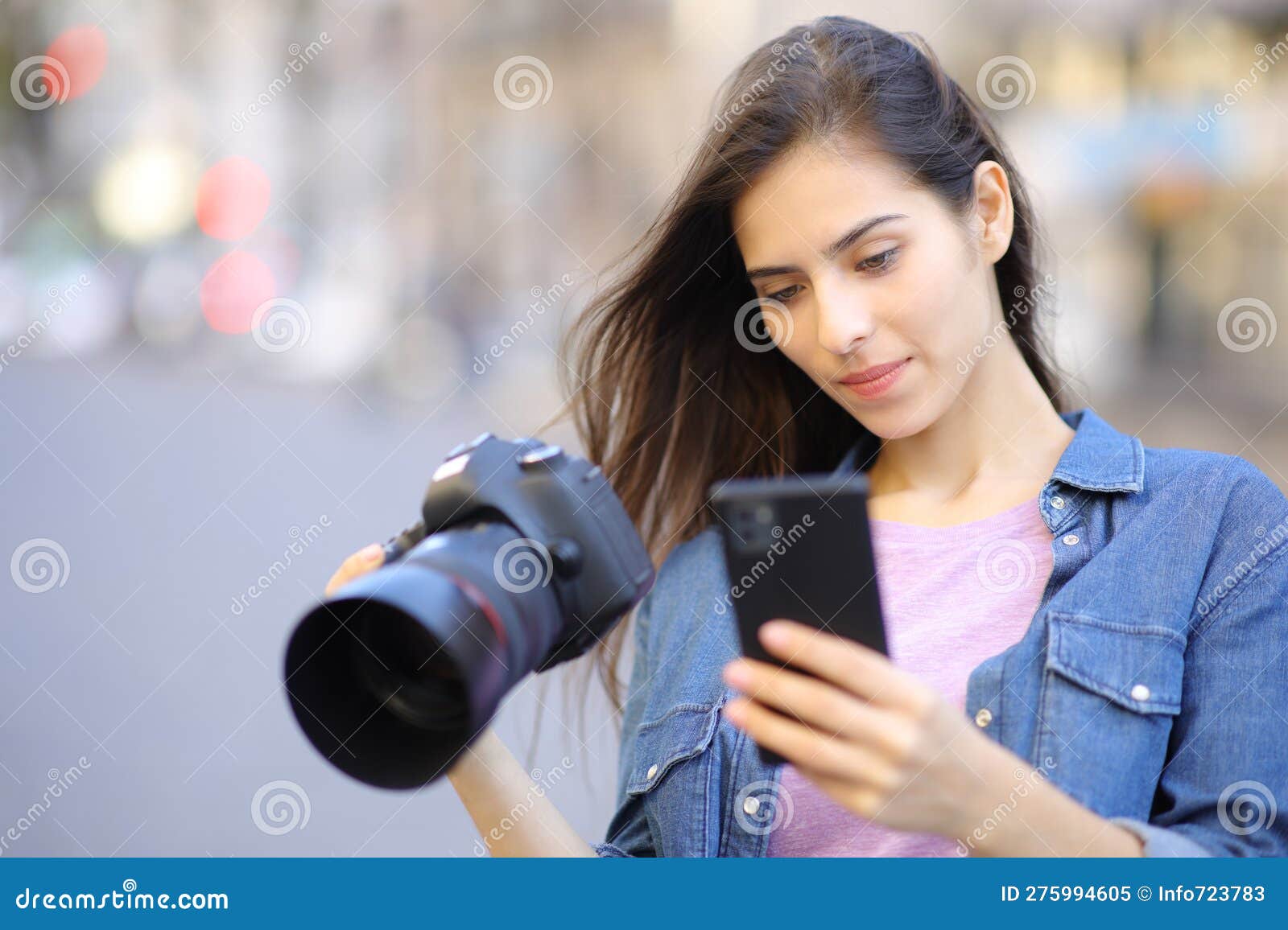 Photographer Using Phone Holding Camera Stock Image - Image of outdoor ...